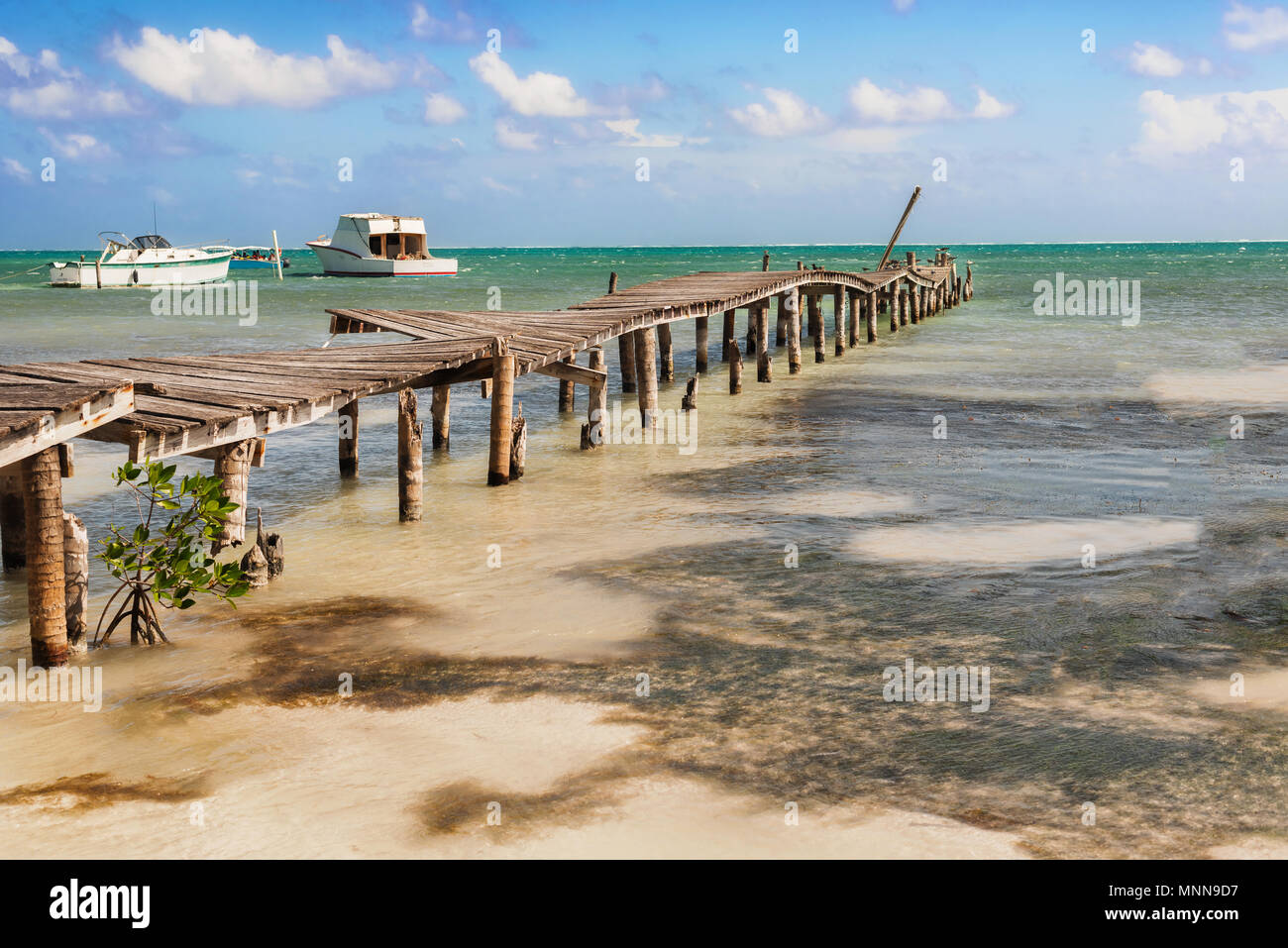 Wooden pier dock destroyed by hurricane and picturesque, relaxing ocean ...