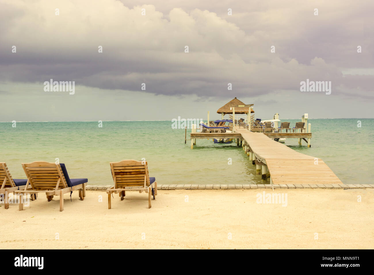 Wooden pier dock and picturesque, relaxing ocean view at Caye Caulker ...