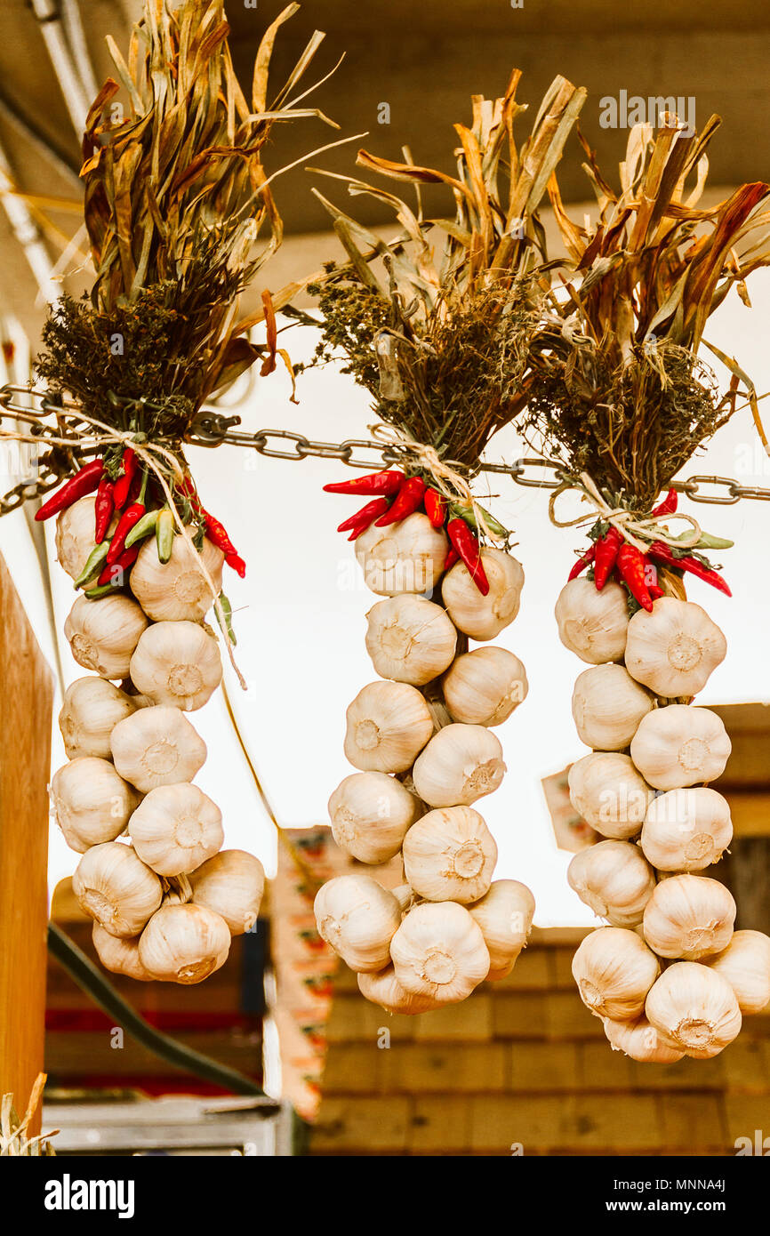 Garlic bunch hanging in a local market Stock Photo - Alamy