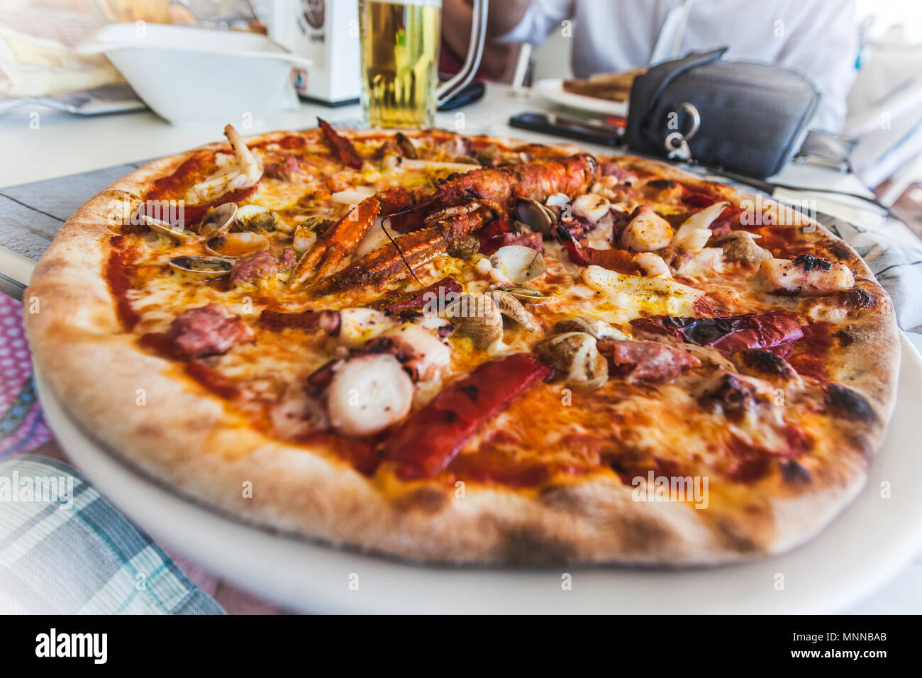 Italian pizza with ingredients based on fish Stock Photo - Alamy