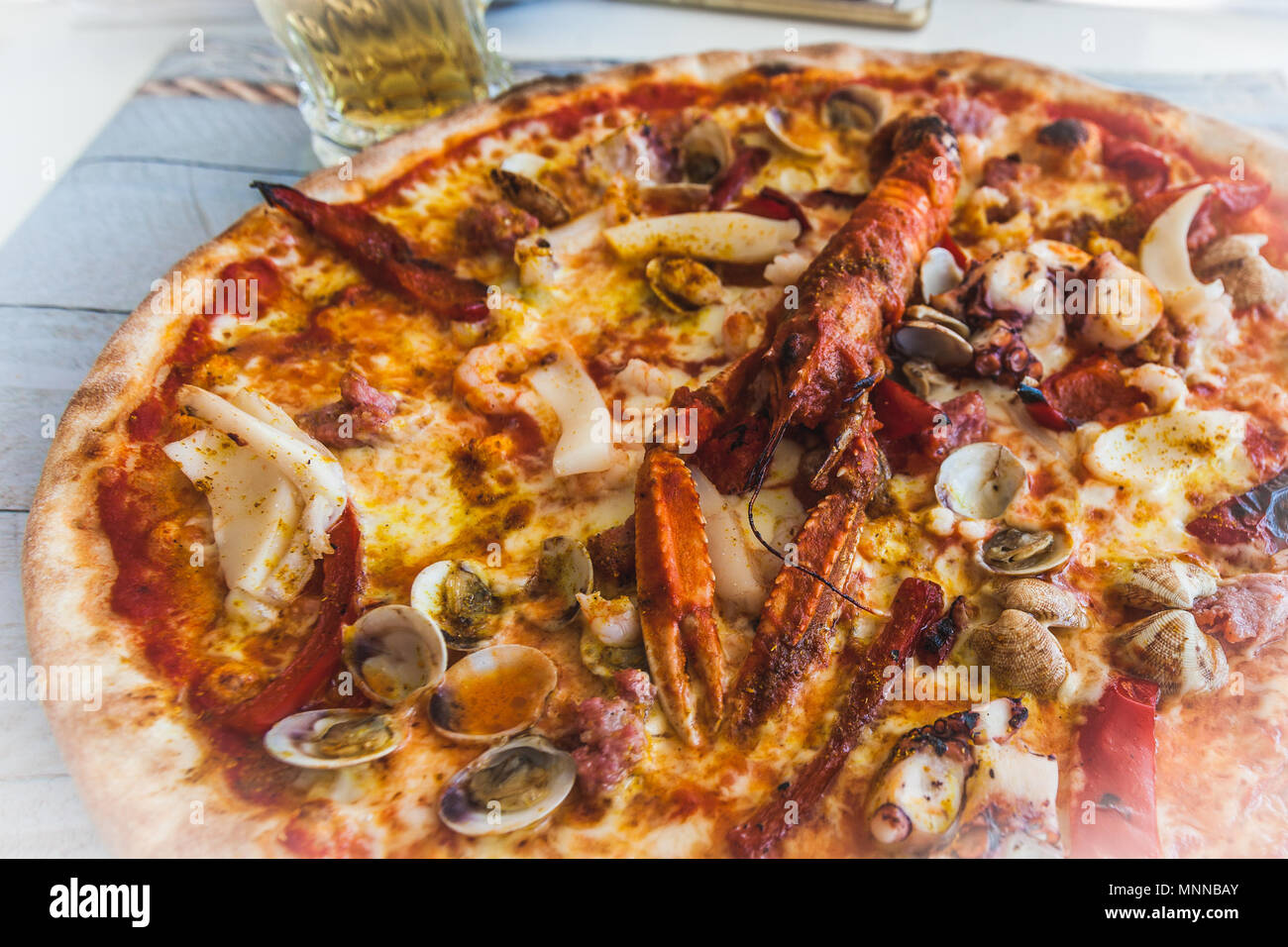 Italian pizza with ingredients based on fish Stock Photo - Alamy