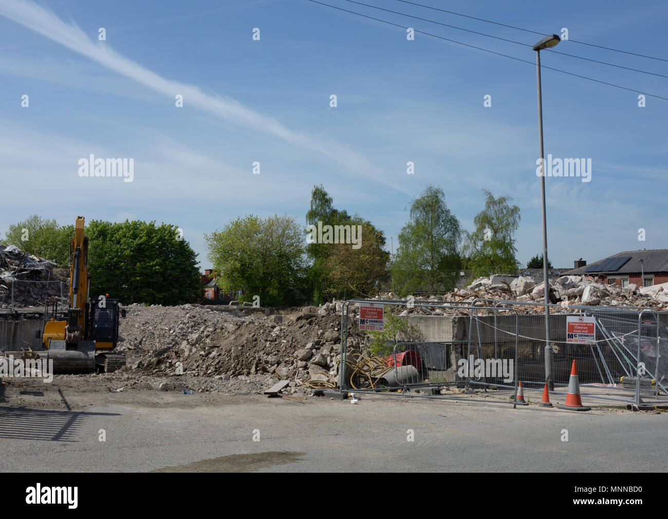 Concrete rubble and security fencing to one side on demolition site ...