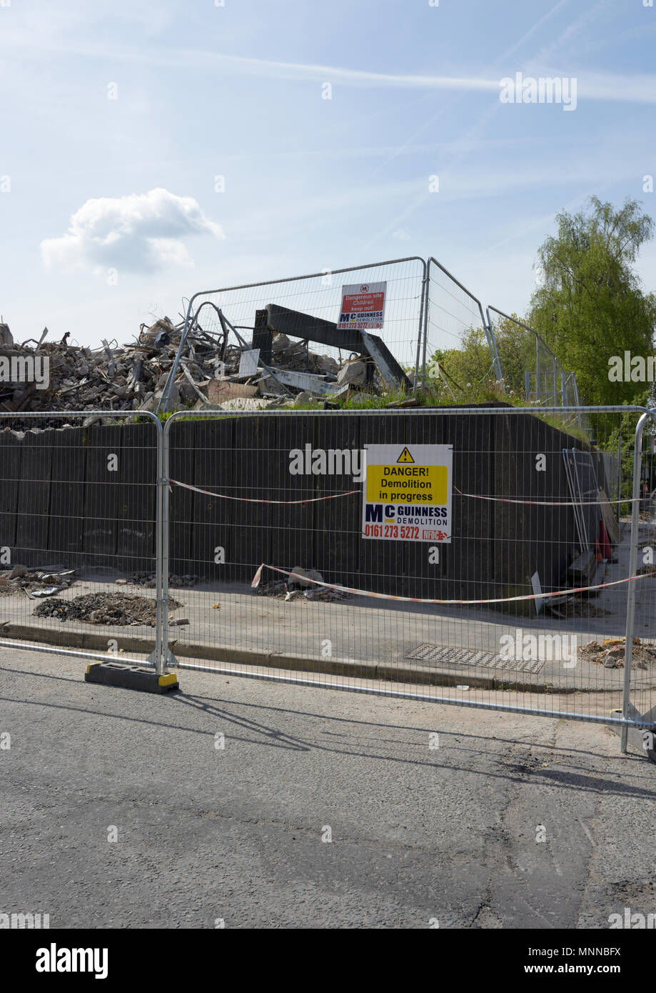 Steel security fencing with danger demolition site warning sign in ...