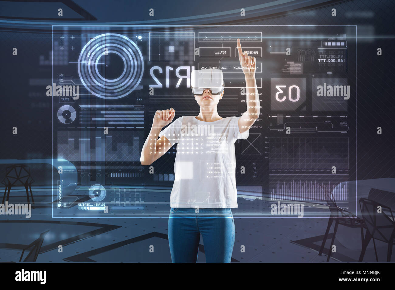 Clever web developer wearing virtual reality glasses and working Stock ...