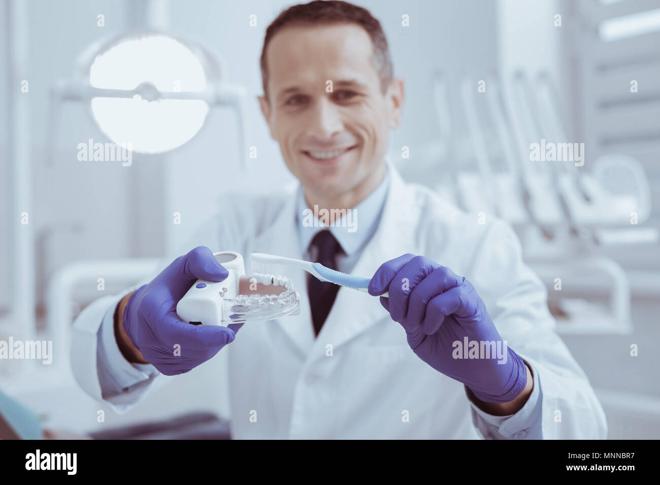 Dentist instructing hi-res stock photography and images - Alamy