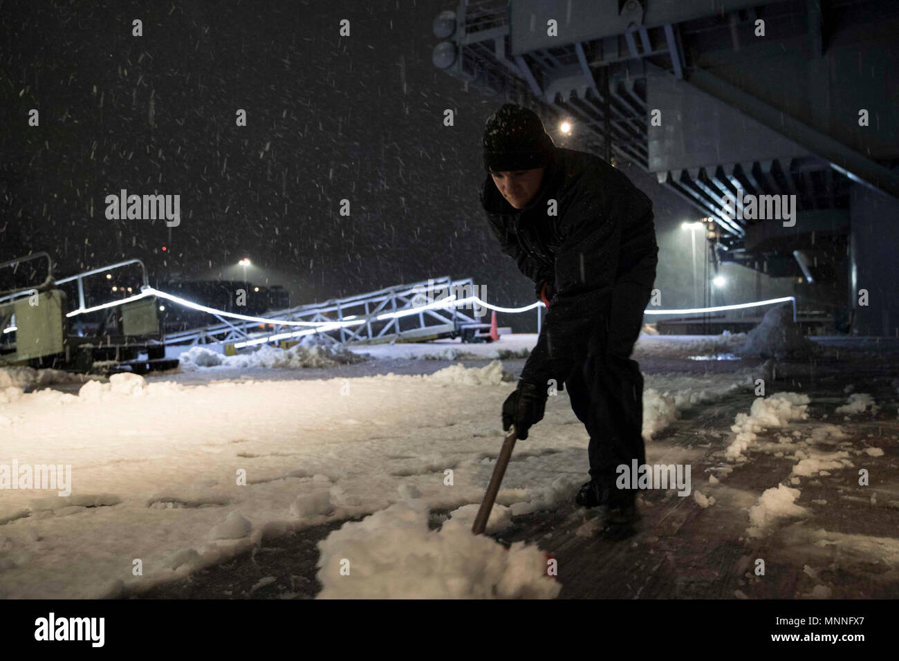 (March 12, 2018) Airman Nicholas Brooks shovels snow on an aircraft ...