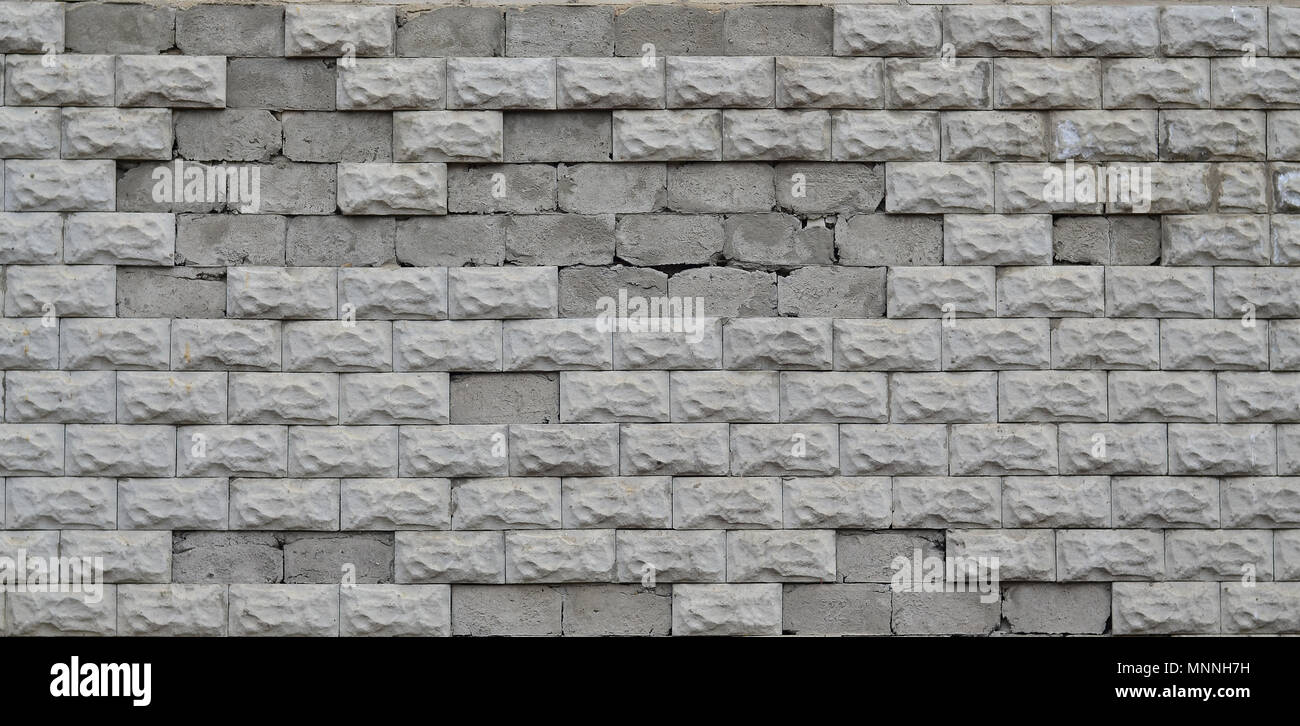 Weathered stained old block wall background. Texture of an old wall of ...