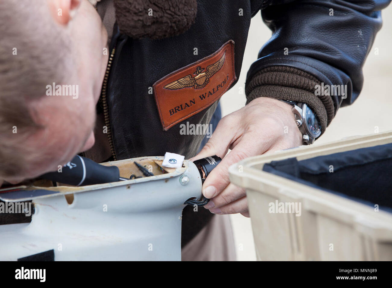 Capt. Brian Walpole, Aircraft Taxi Instructor, VMFA 232, fixes an ...