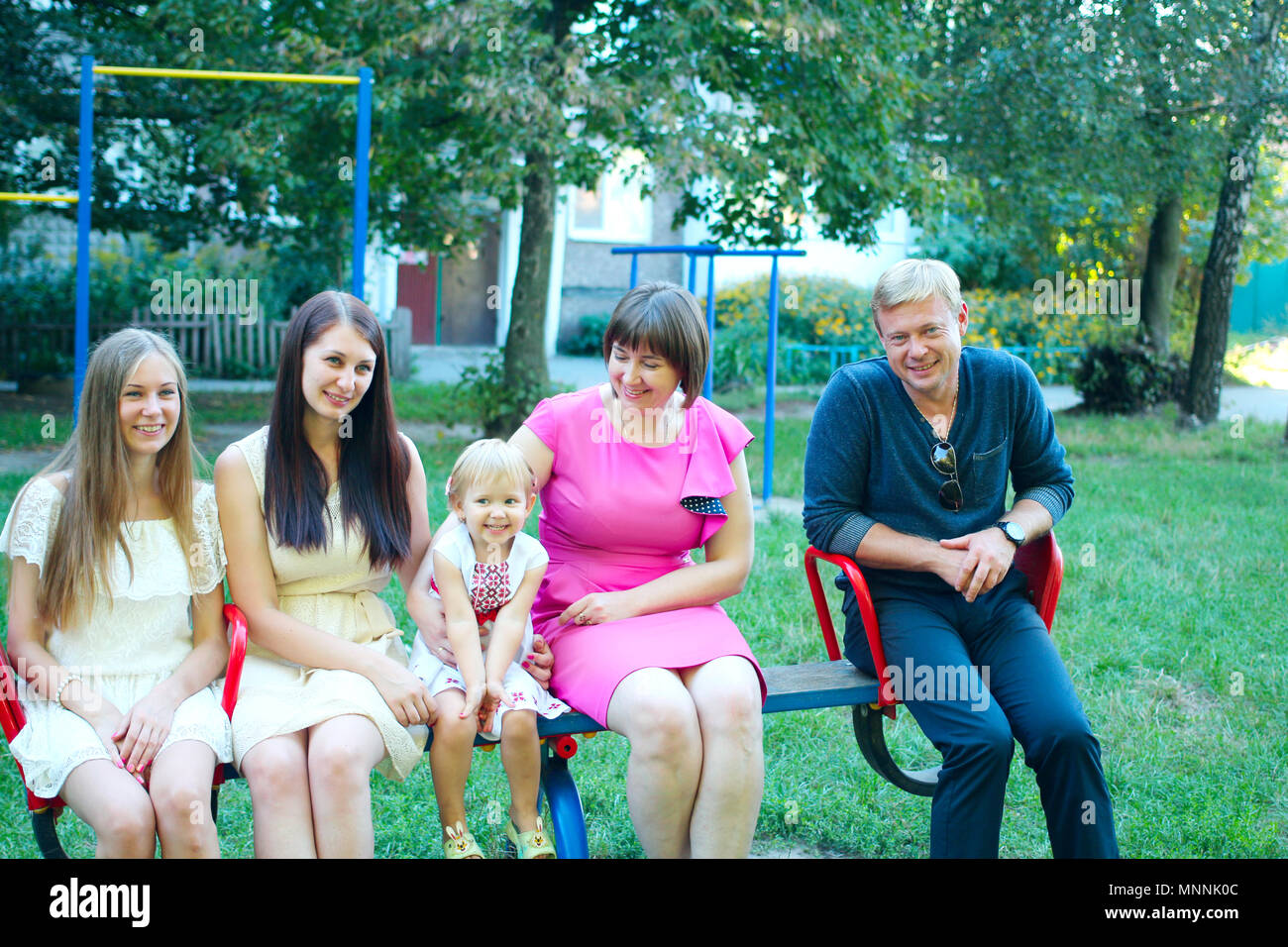 Funny relatives at the party have fun and indulge in a swing. Happy ...