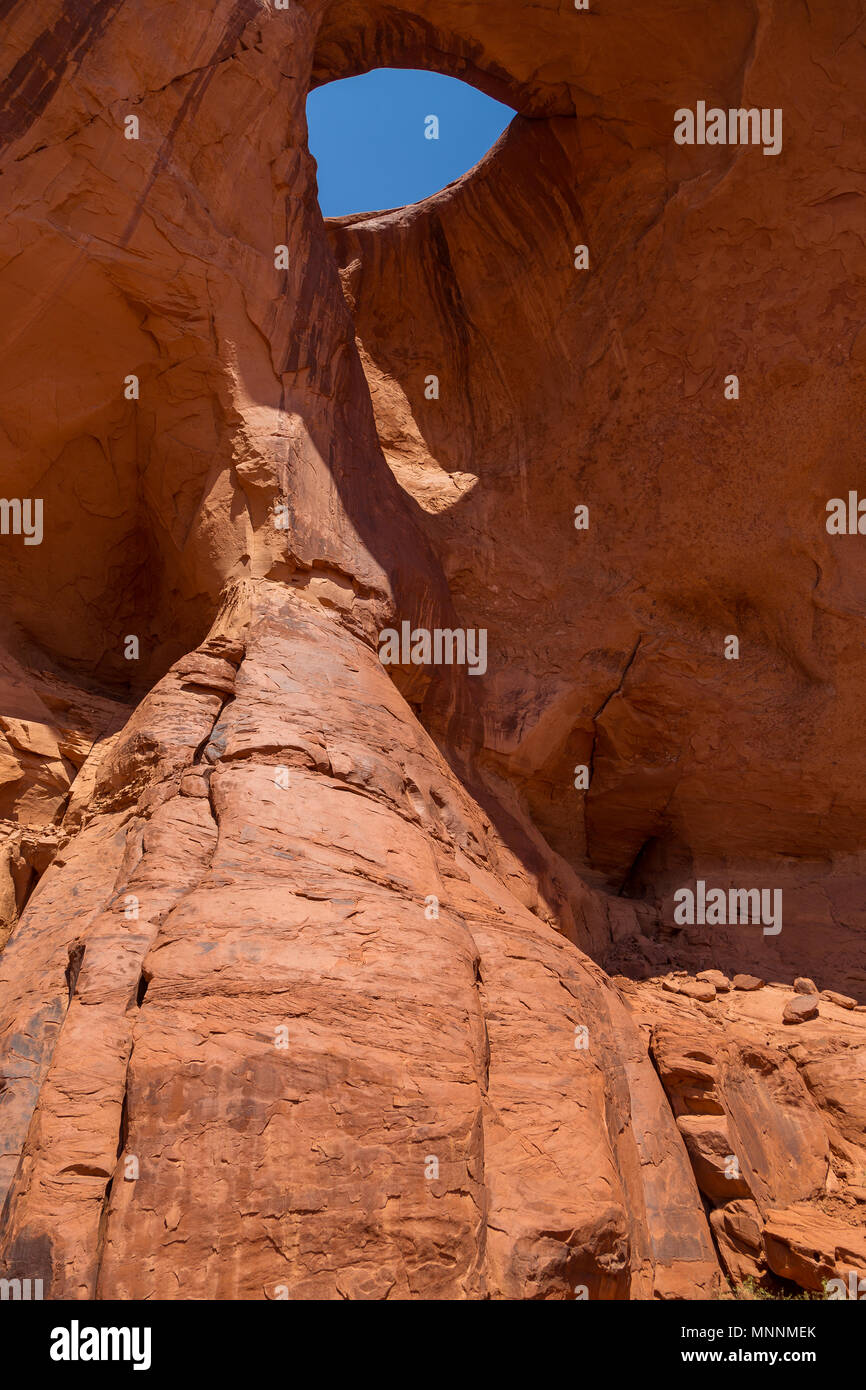 Suns eye. Pothole natural arch eroded in sandstone. Navajo Tribal Park ...