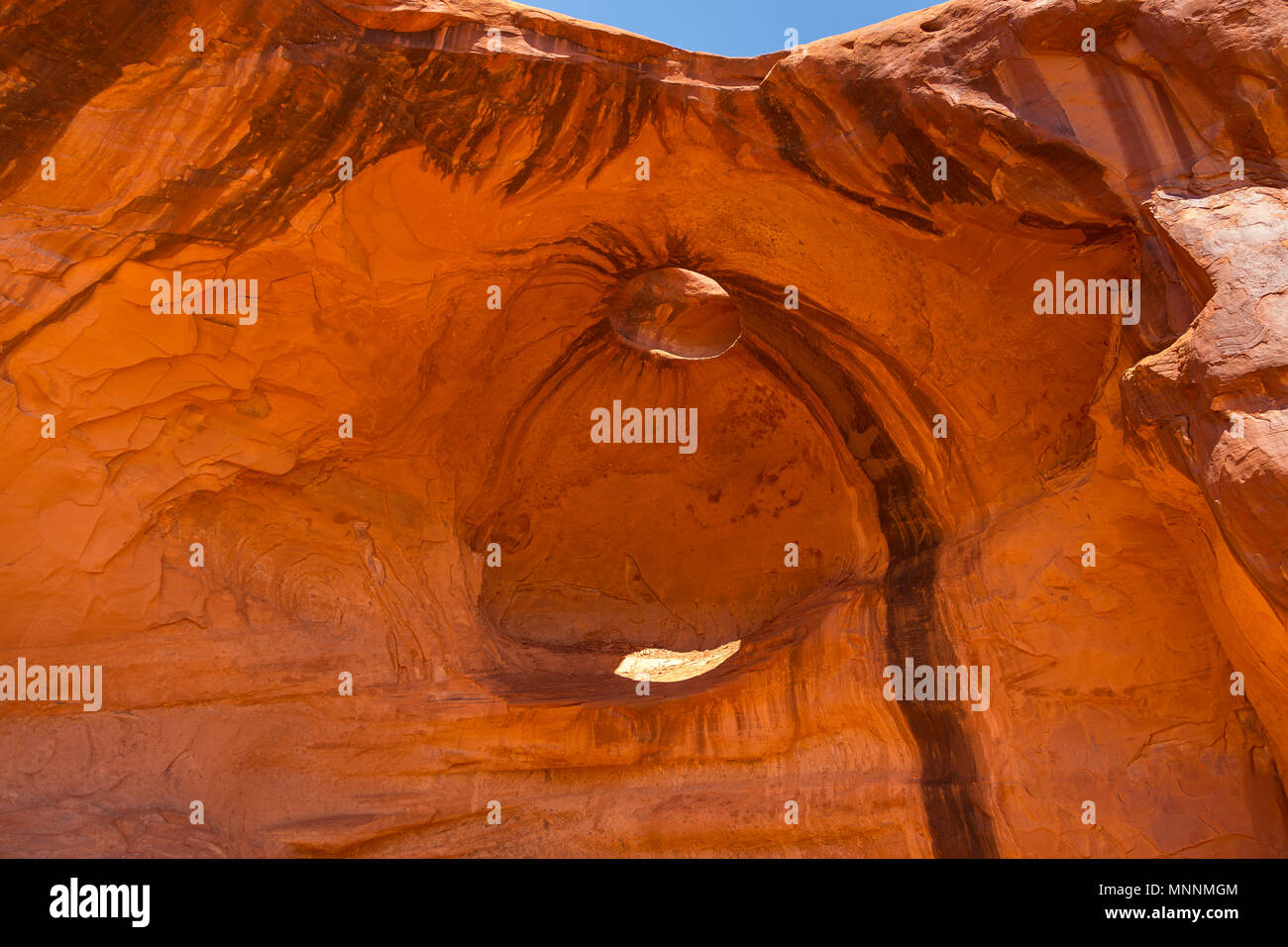 Eye of the eagle Big Hogan. Pothole natural arch eroded in sandstone ...