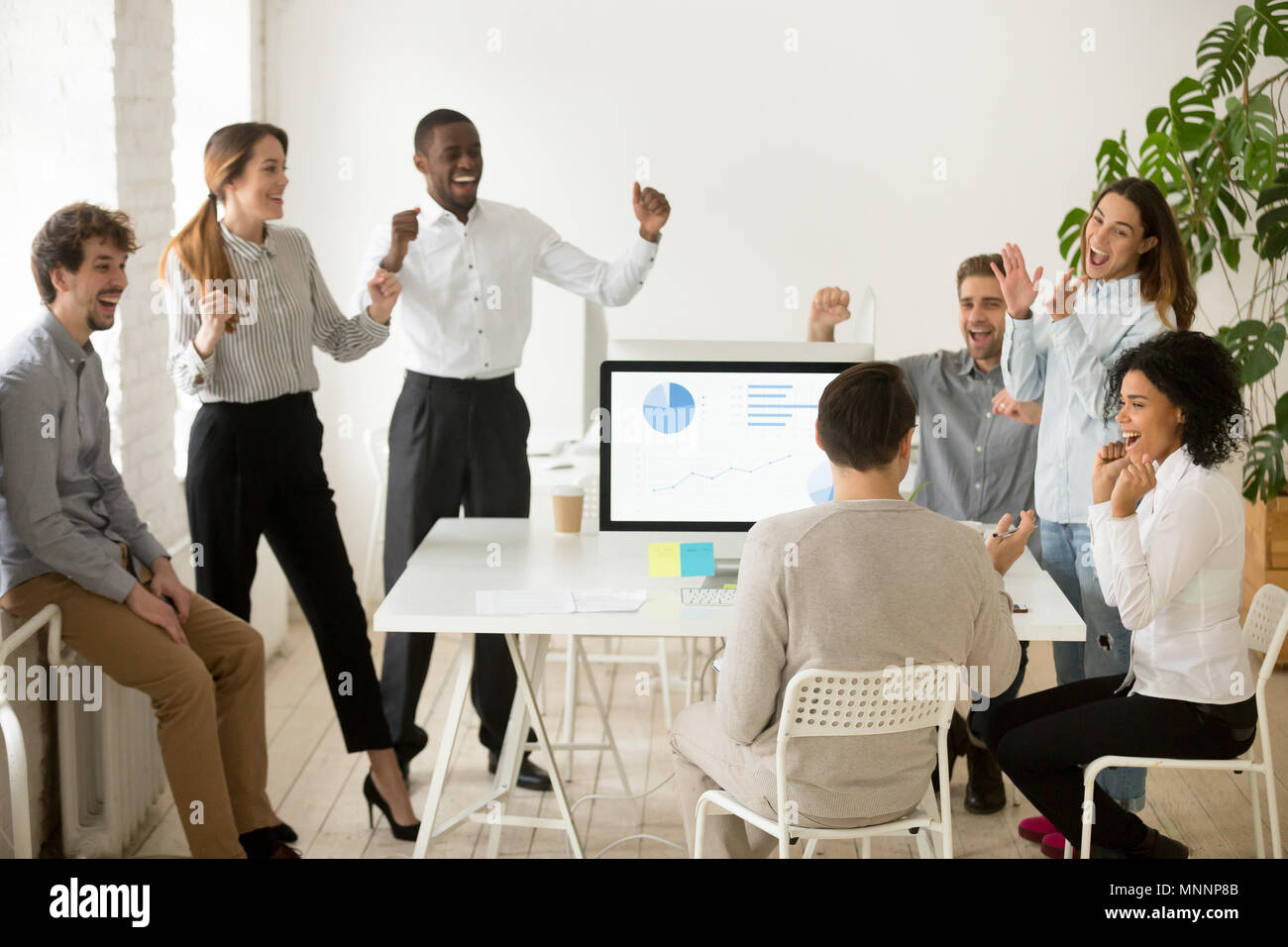Excited by good news motivated colleagues celebrating corporate Stock ...