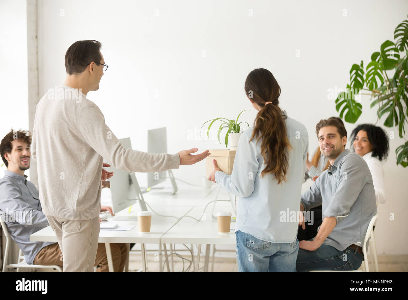 Company boss introducing new hire employee to colleagues, rear v Stock ...