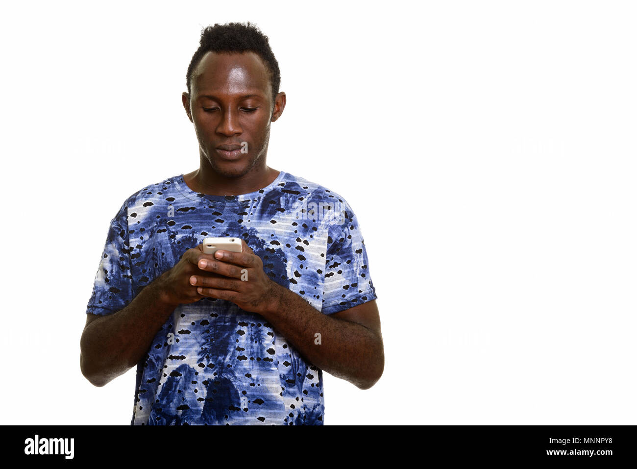 Young black African man using mobile phone Stock Photo - Alamy