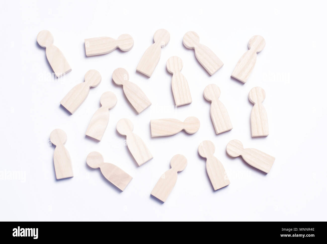Wooden figures of people on a white background. The concept of society ...