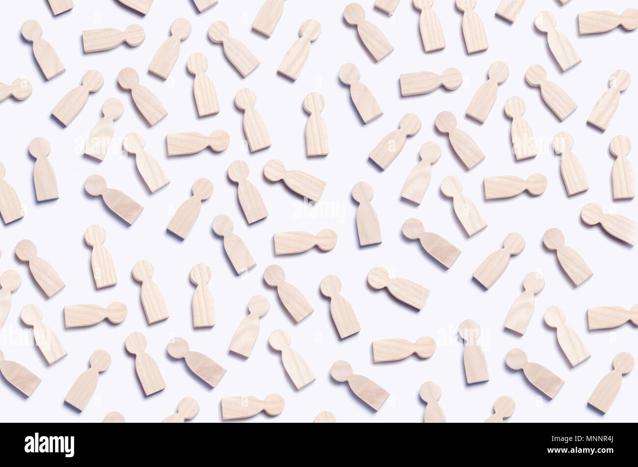 Wooden figures of people on a white background. The concept of society ...