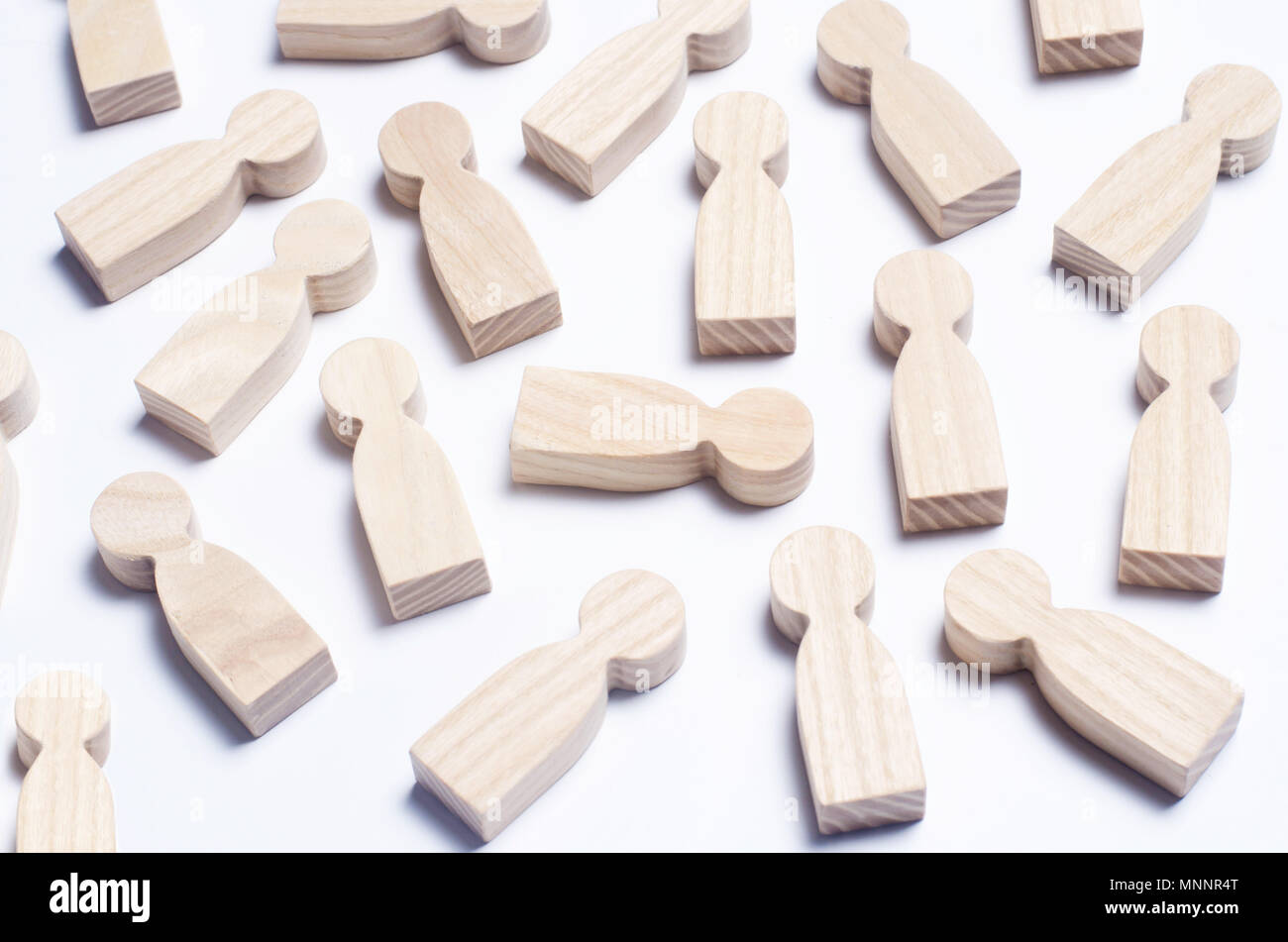 Wooden figures of people on a white background. The concept of society ...