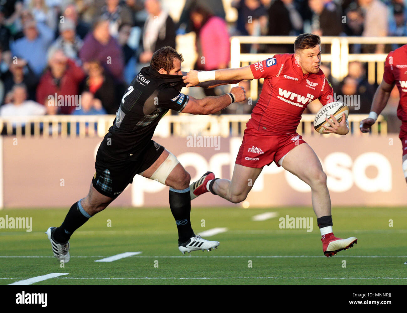 Glasgow Warriors' Fraser Brown (left) tackles Scarlets' Steffan Evans ...