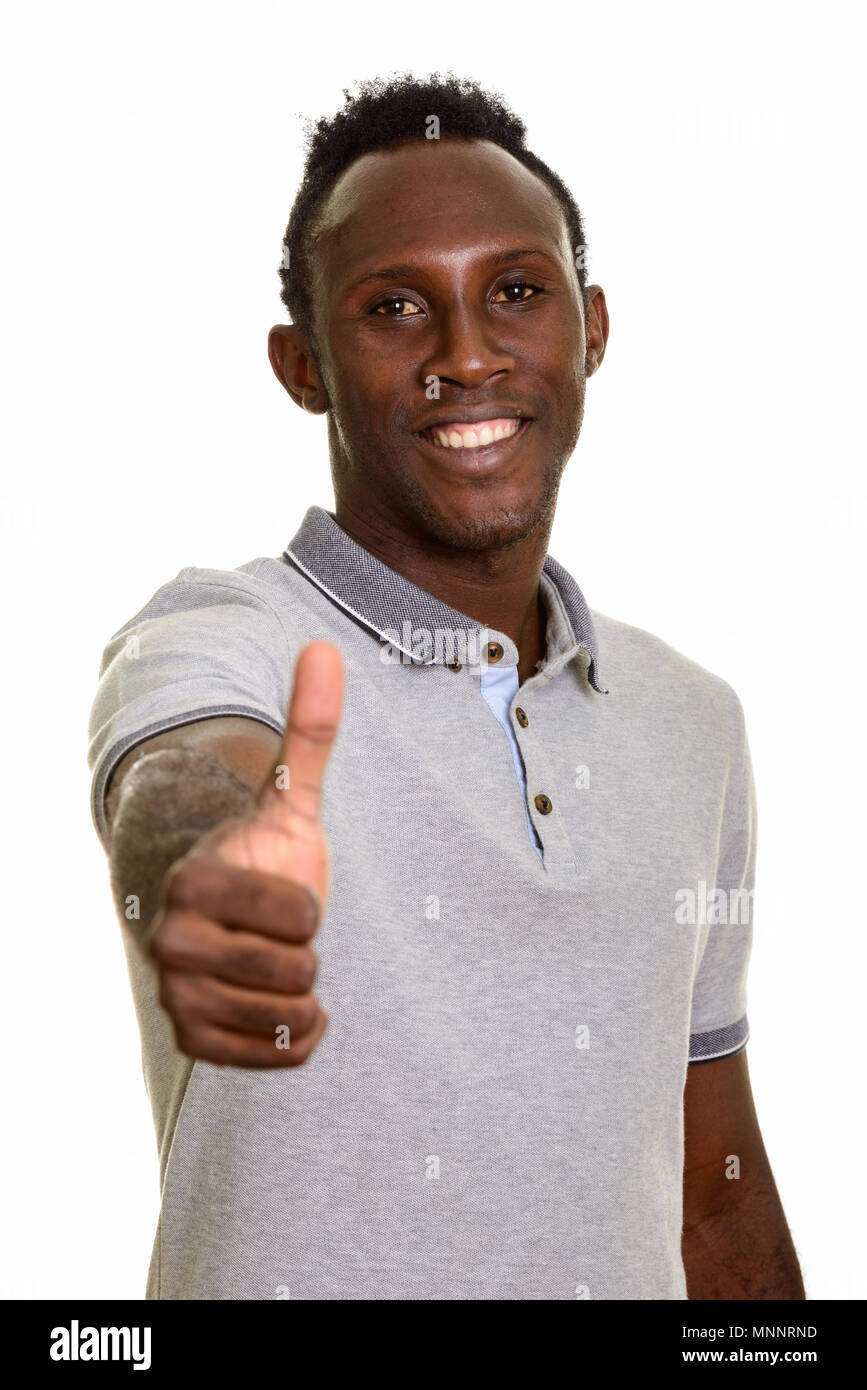 Young happy African man smiling and giving thumb up Stock Photo - Alamy