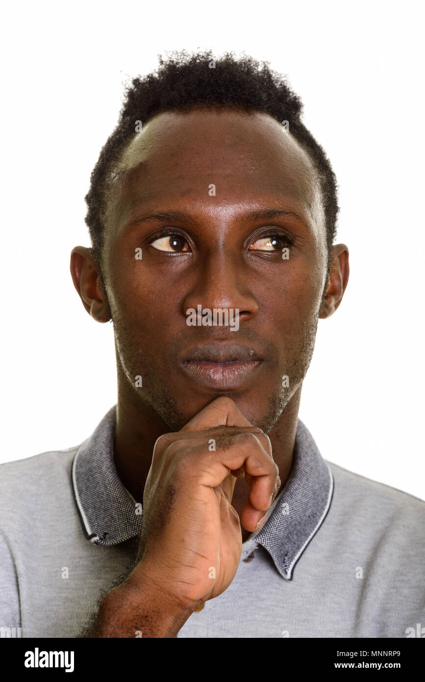Face of young black African man thinking Stock Photo - Alamy
