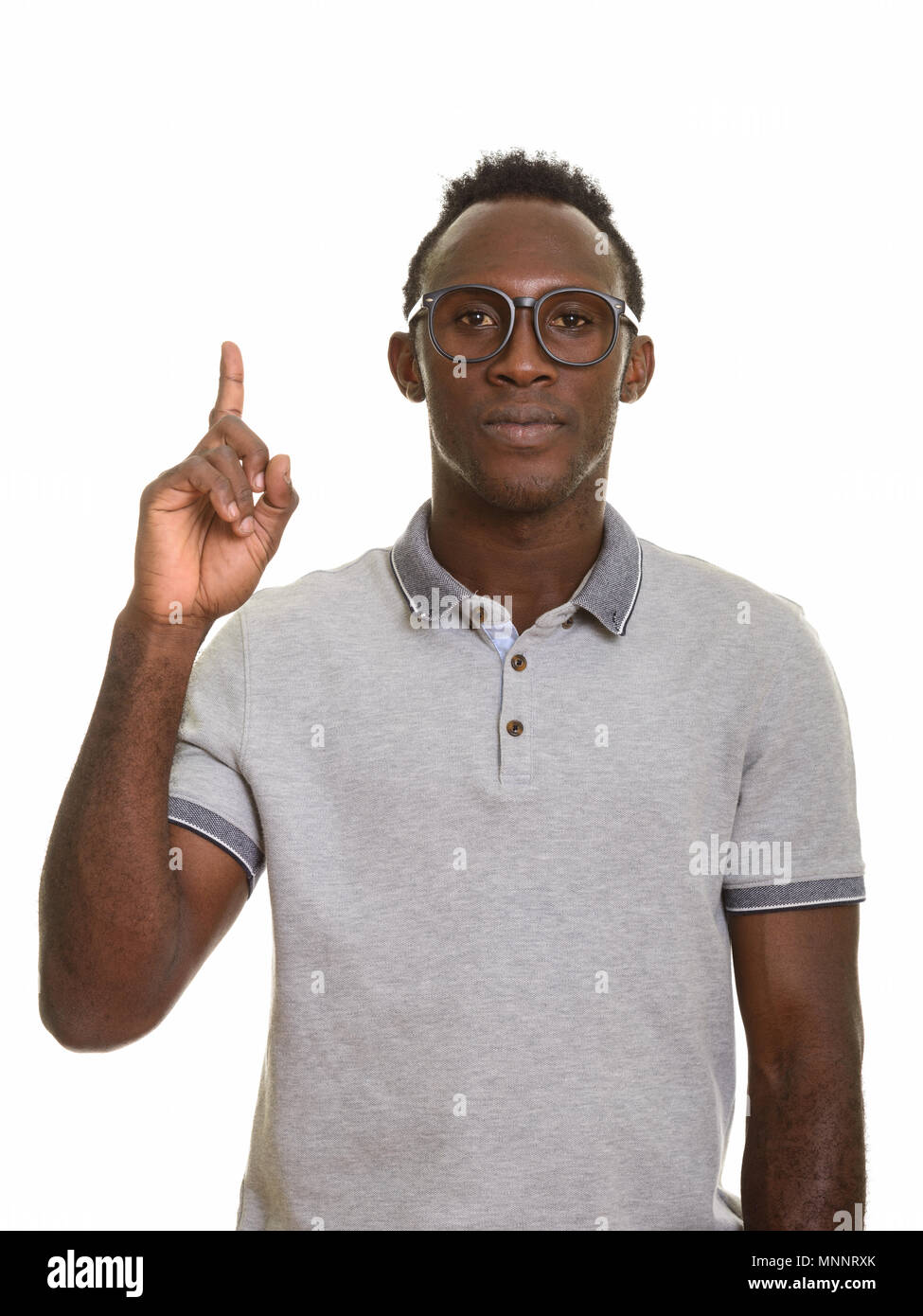 Young black African man pointing finger up Stock Photo - Alamy