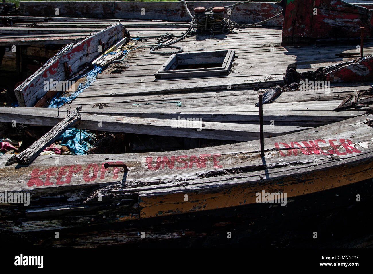 Warning Sign on a Rotting Wooden Structure of an old cargo barge Stock ...