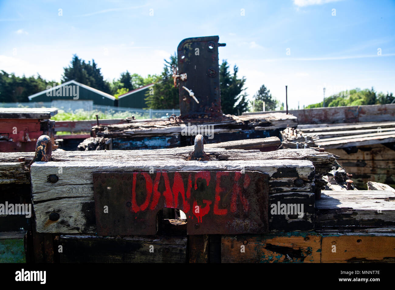 Danger sign on Rotting Wooden Structure of an old cargo barge Stock ...