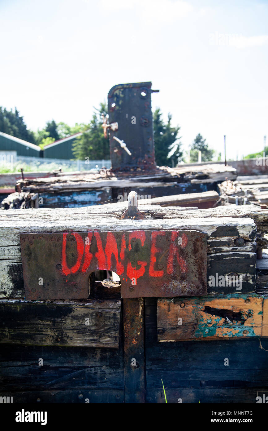 Danger sign on Rotting Wooden Structure of an old cargo barge Stock ...