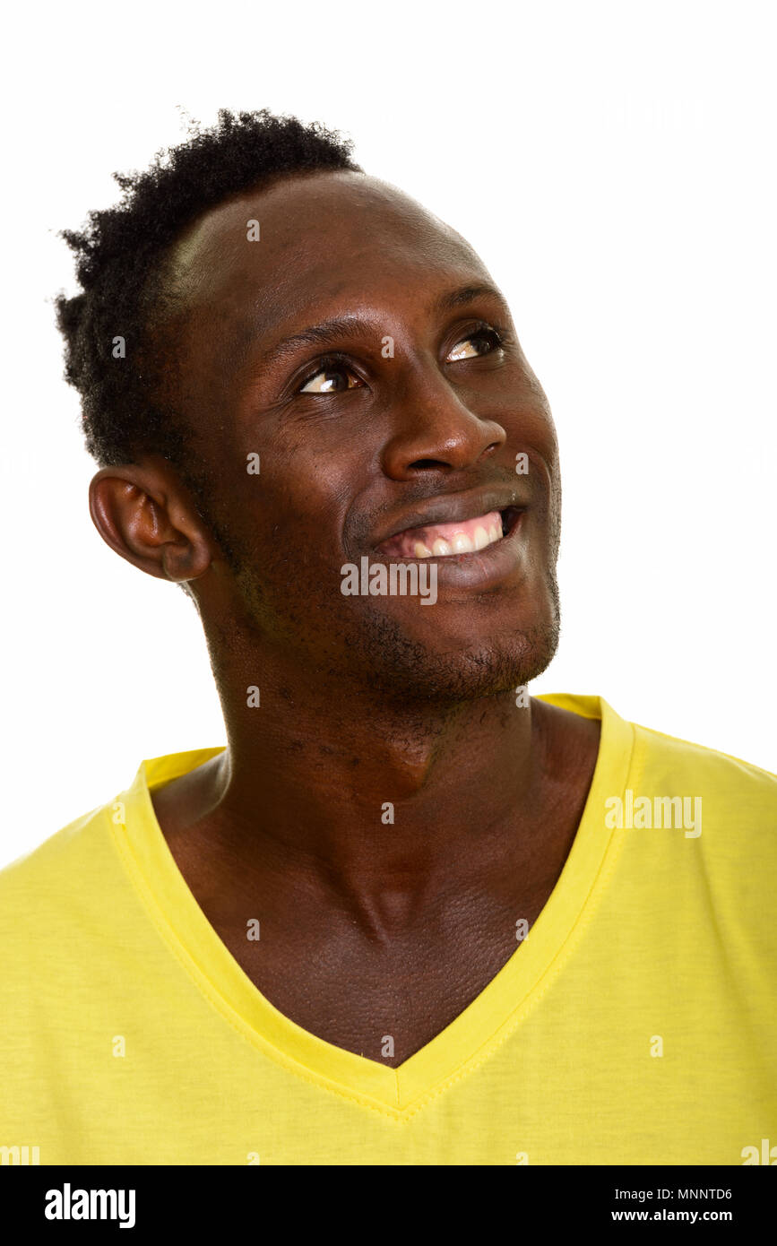 Face of young happy African man smiling and thinking Stock Photo - Alamy