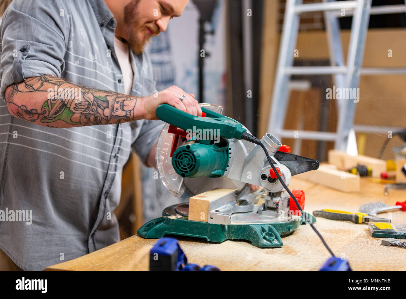 circular saw for cutting boards into the hands of the builder, the man ...