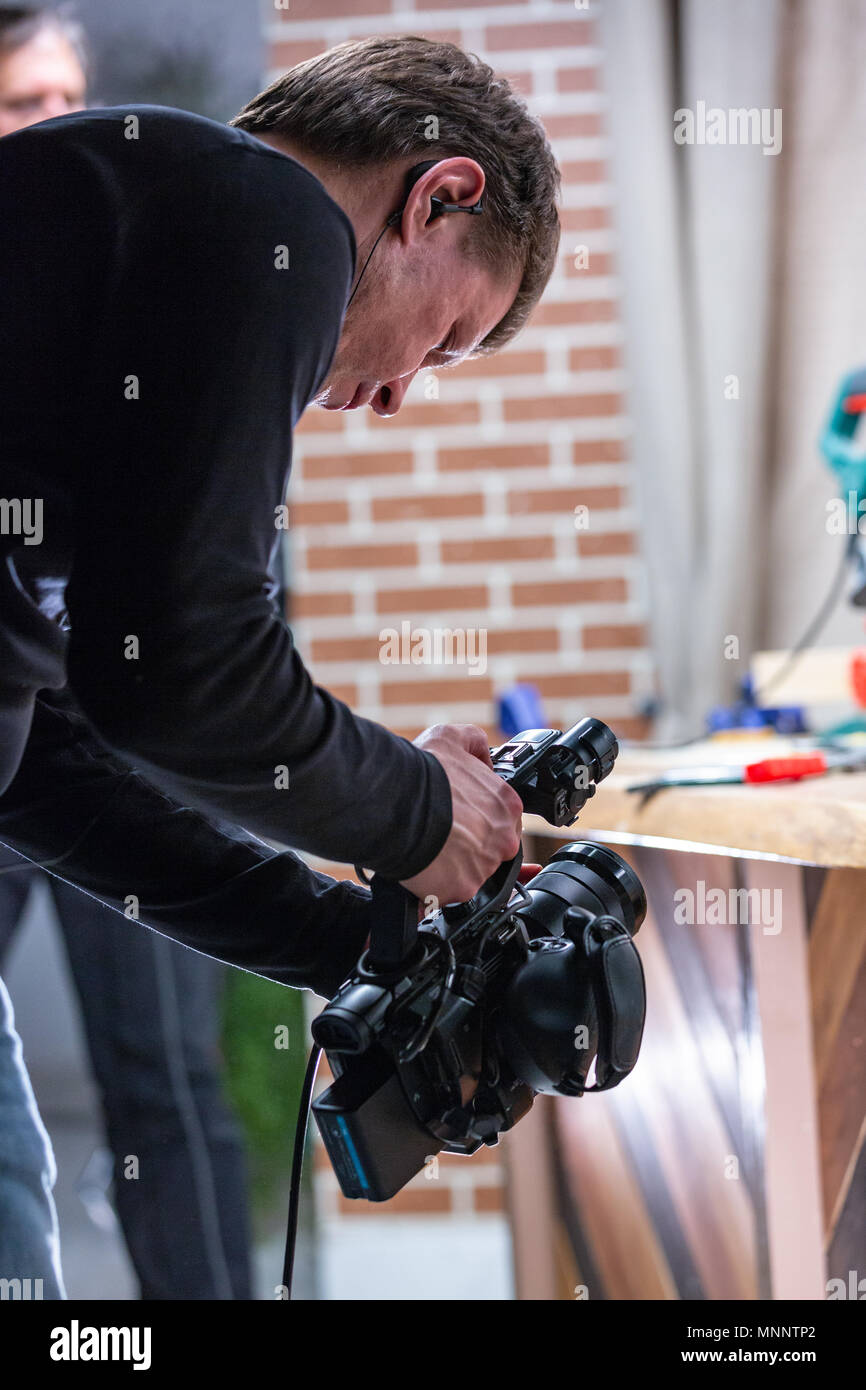 camera operator working with a cinema camera on the work site Stock ...