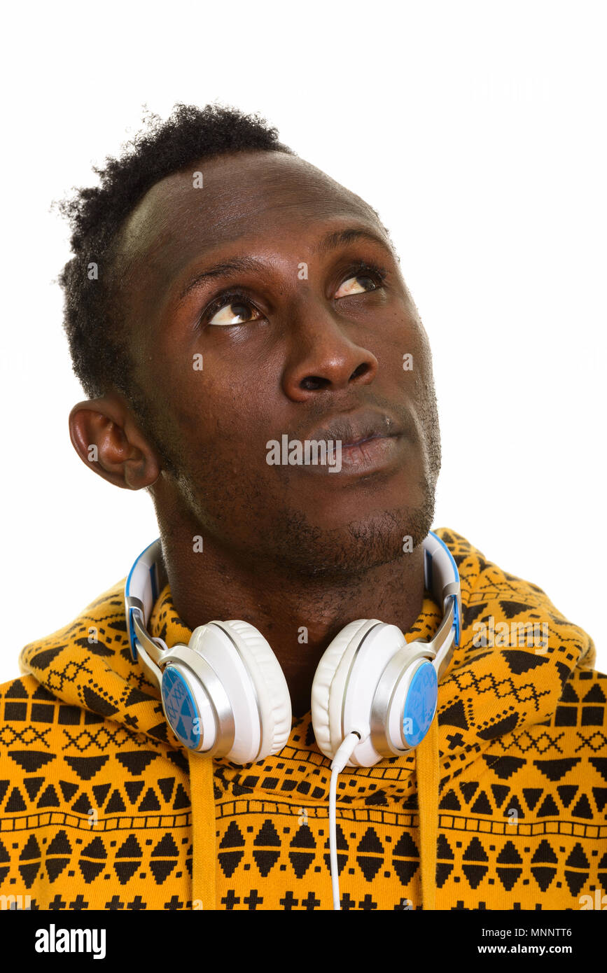Face of thoughtful young black African man wearing headphones ar Stock ...