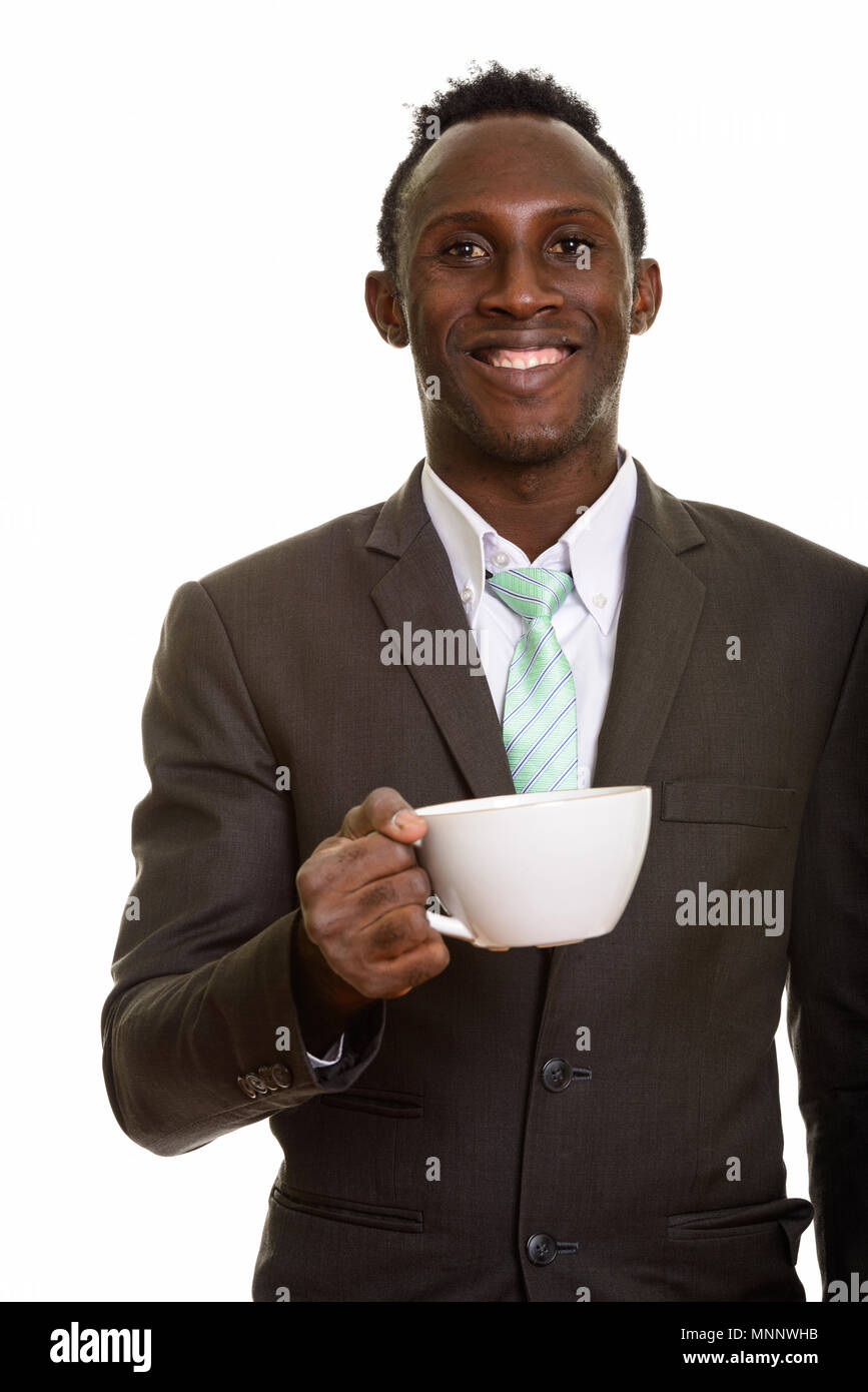 Young happy black African businessman smiling and holding coffee Stock ...