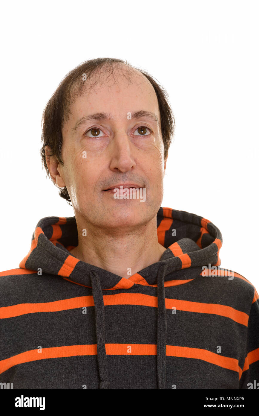 Face of mature man looking up while thinking Stock Photo - Alamy