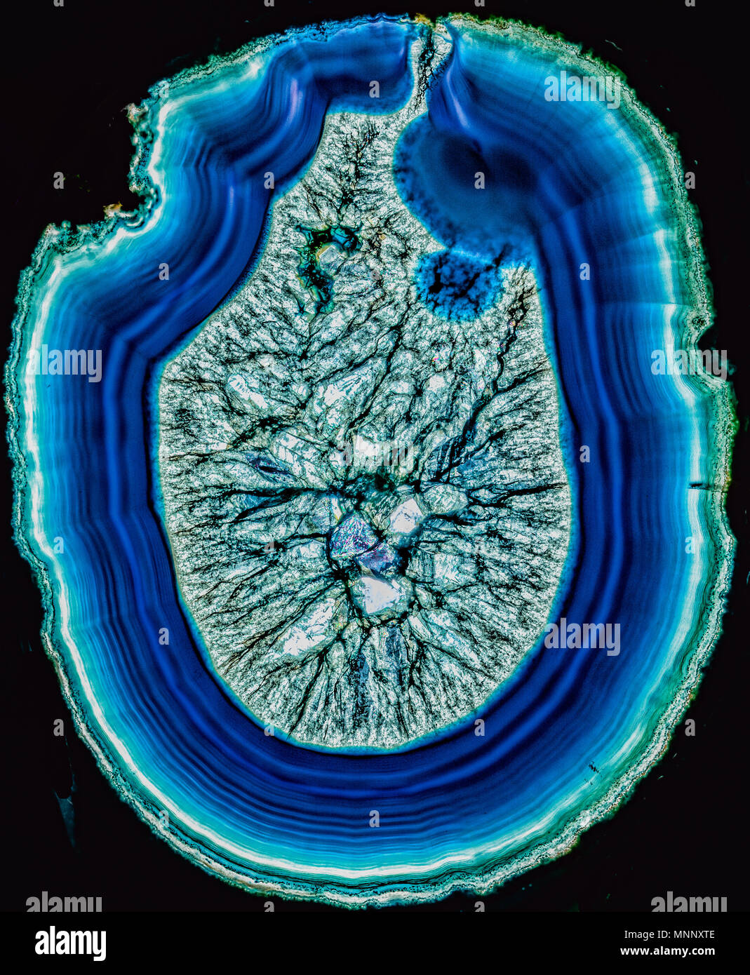 Concept of a volcano breaking through the surface (slice of blue agate ...