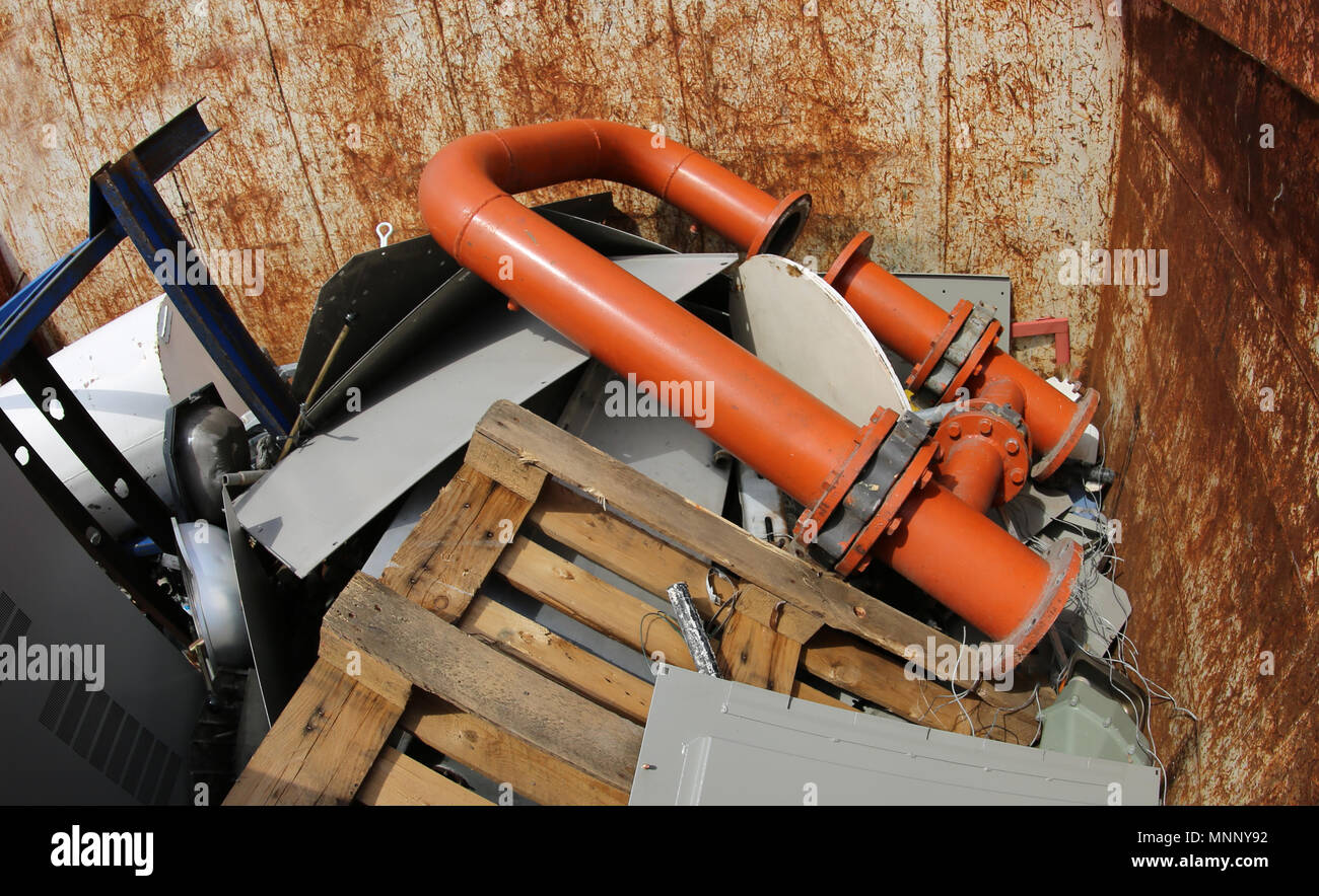 orange disused tube of a dump in an iron collection center Stock Photo ...