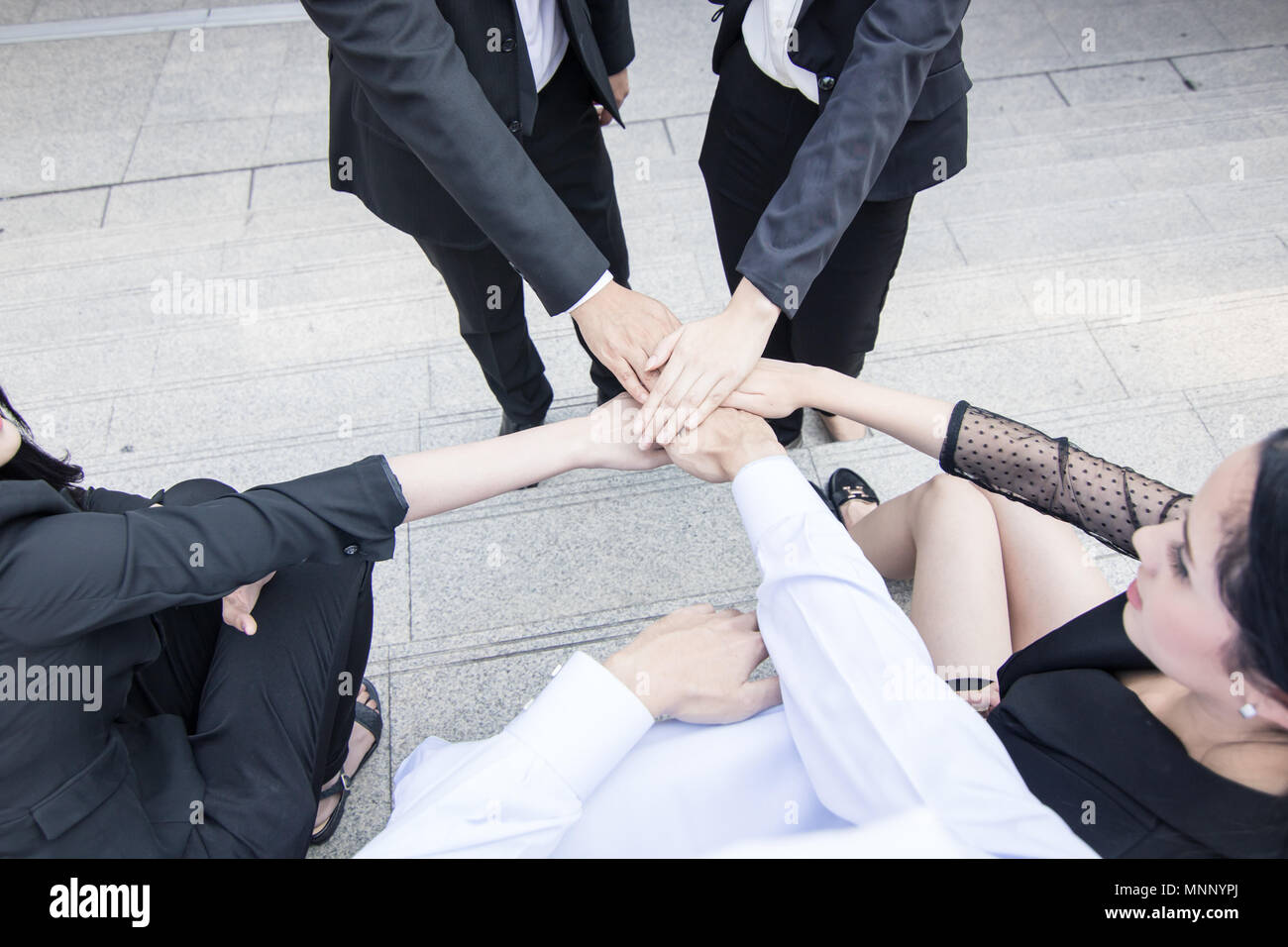 Group businesspeople joining together hi-res stock photography and ...