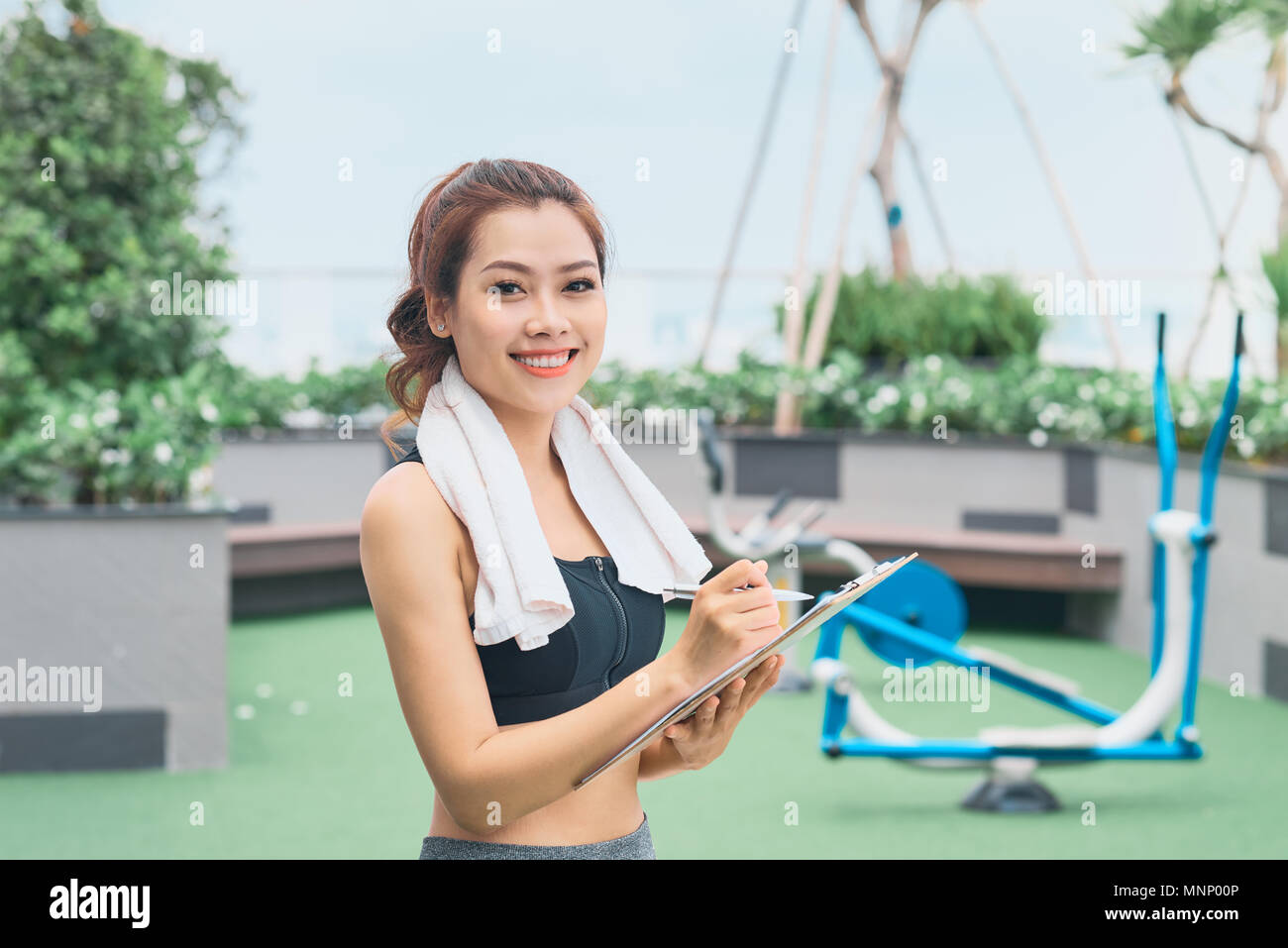 Woman preparing workout plan for training Stock Photo - Alamy