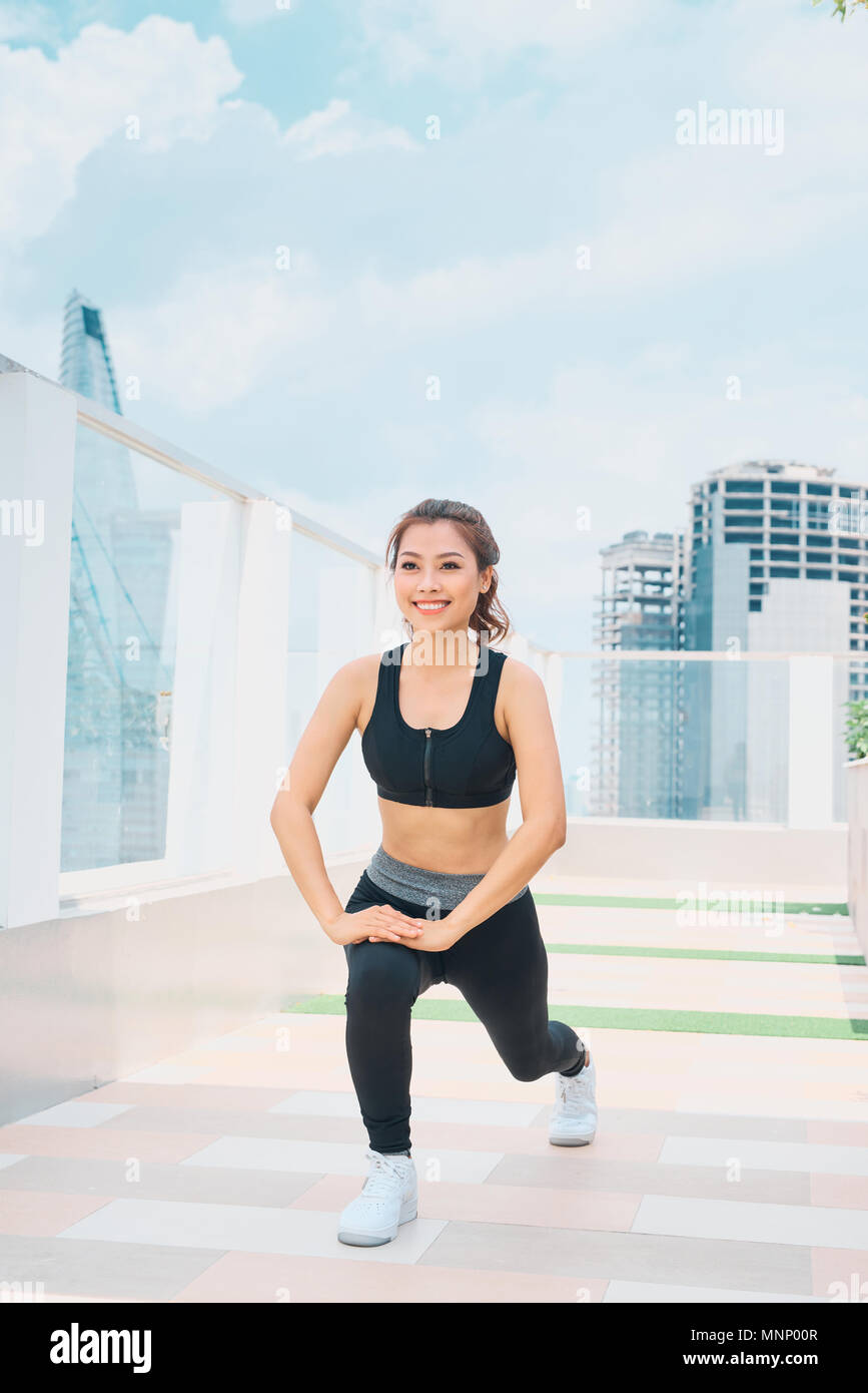 Young asian woman in sport wear doing sports outdoors Stock Photo - Alamy