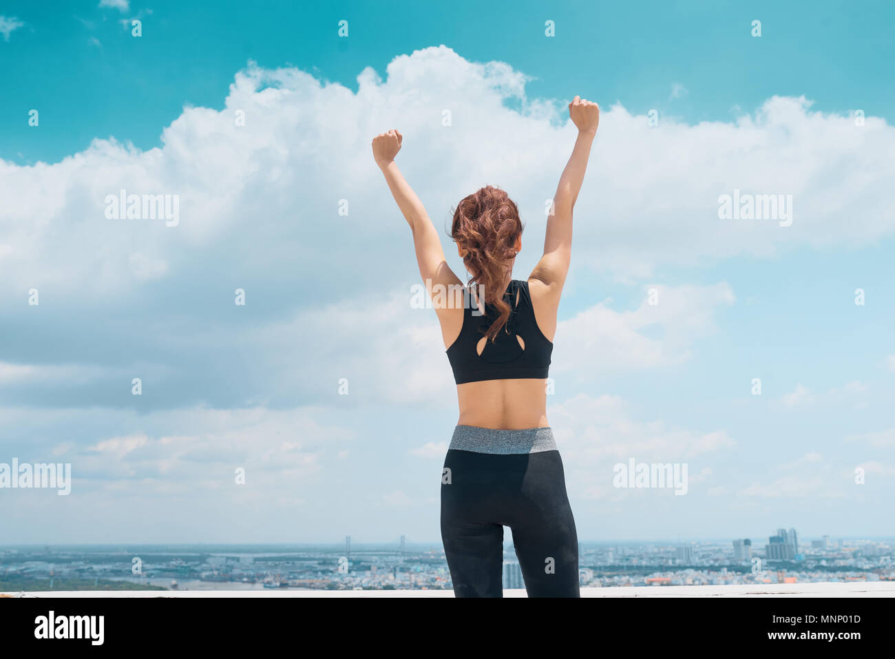 Female happy jogging arms air hi-res stock photography and images - Alamy