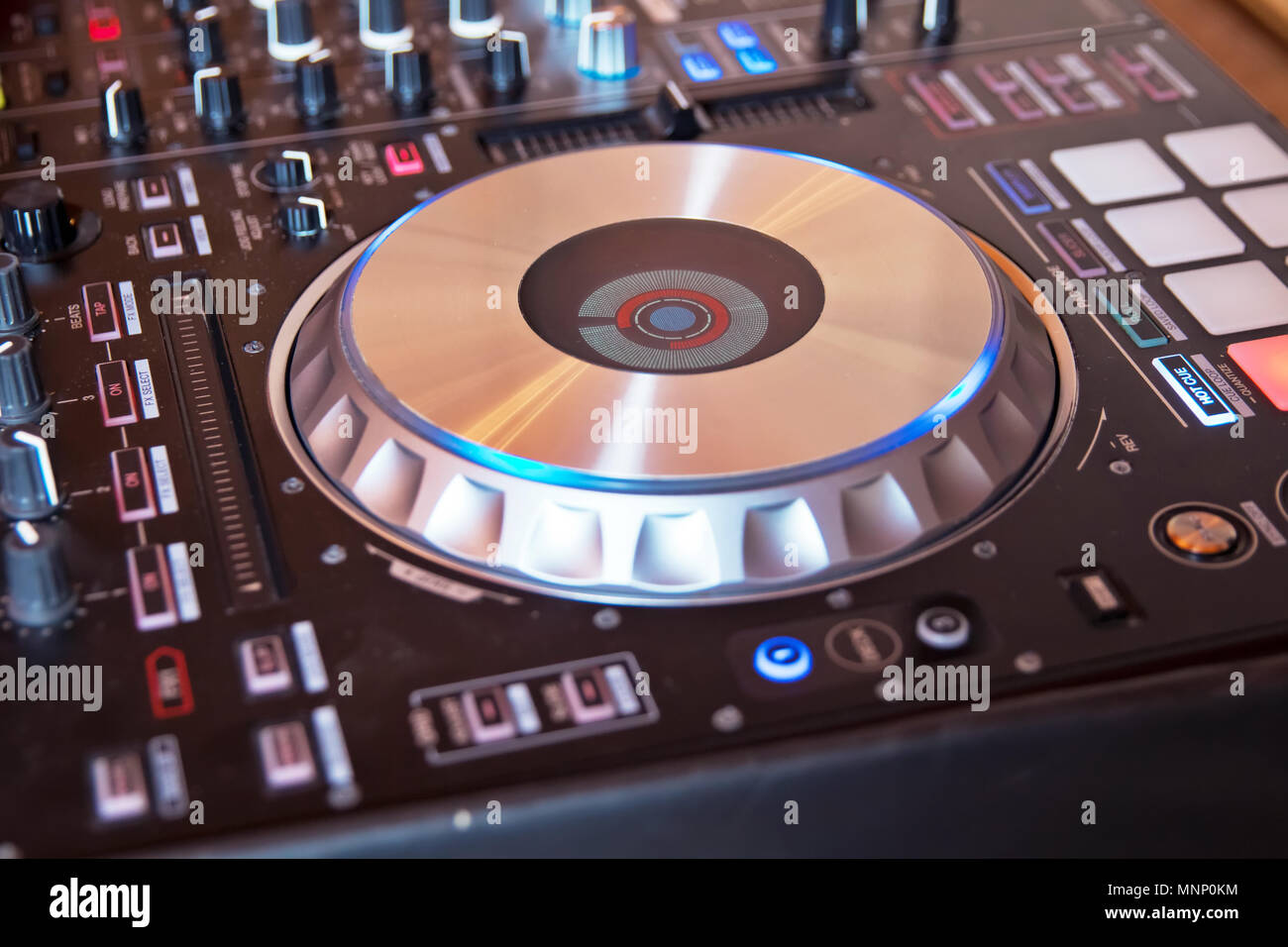 DJ booth at night club party for music mixing. DJ Spinning, Mixing, and ...