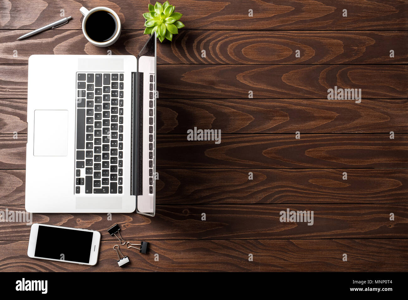 Overhead shot of office desktop with laptop Stock Photo - Alamy