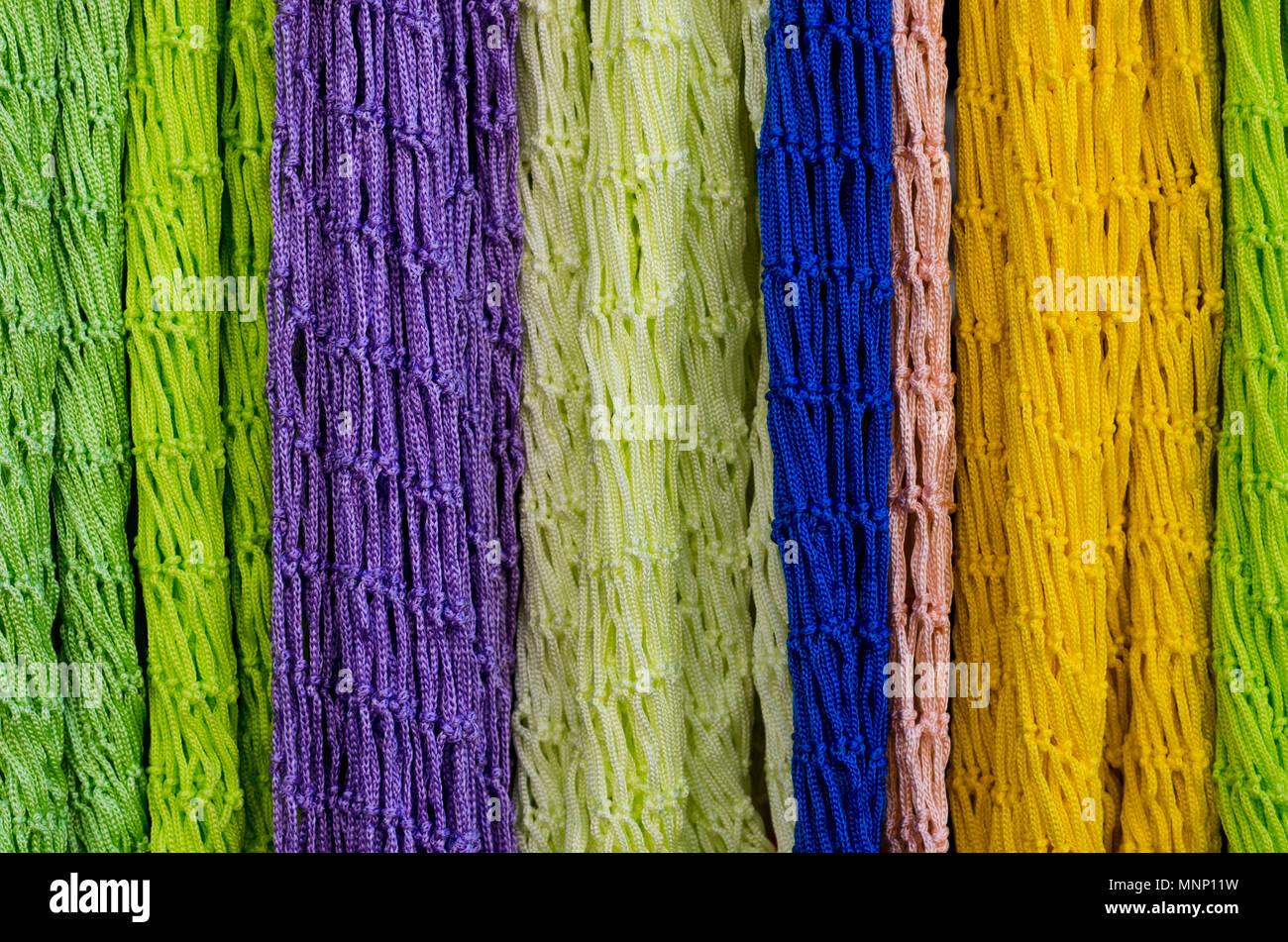 Colorful background and textures of knotted textile Stock Photo - Alamy