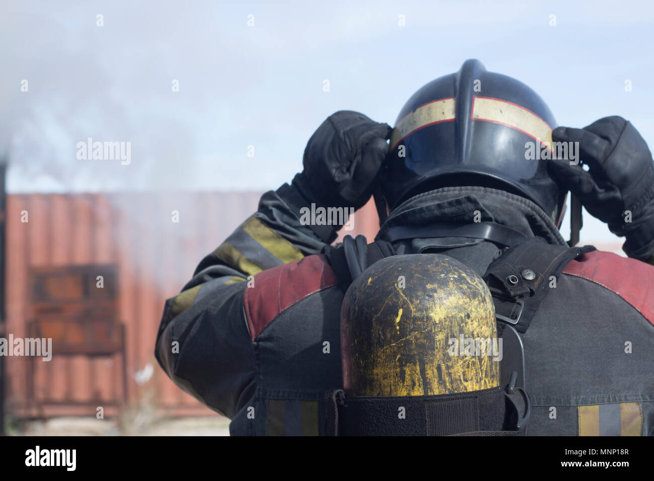 Firefighter putting out fire training station extinguisher backdraft ...