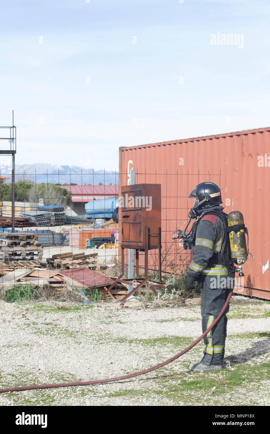 Firefighter putting out fire training station extinguisher backdraft ...