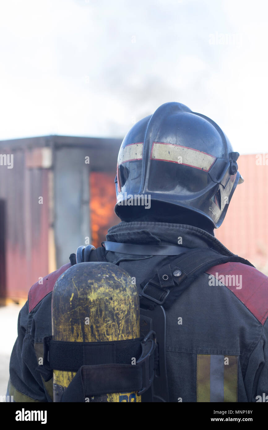 Firefighter putting out fire training station extinguisher backdraft ...