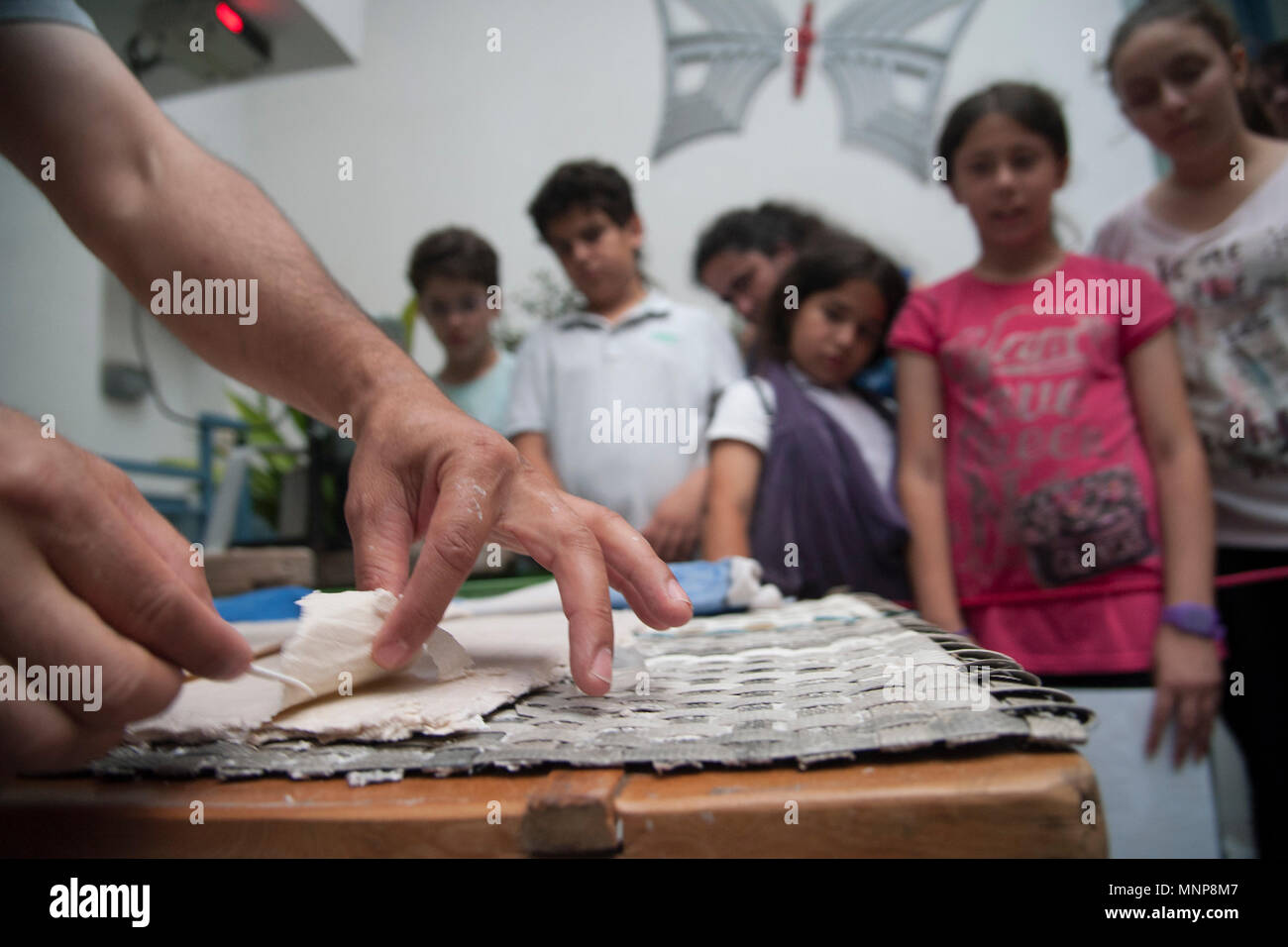 Athens, Greece. 18th May, 2018. A craftsman shows how to make ancient ...