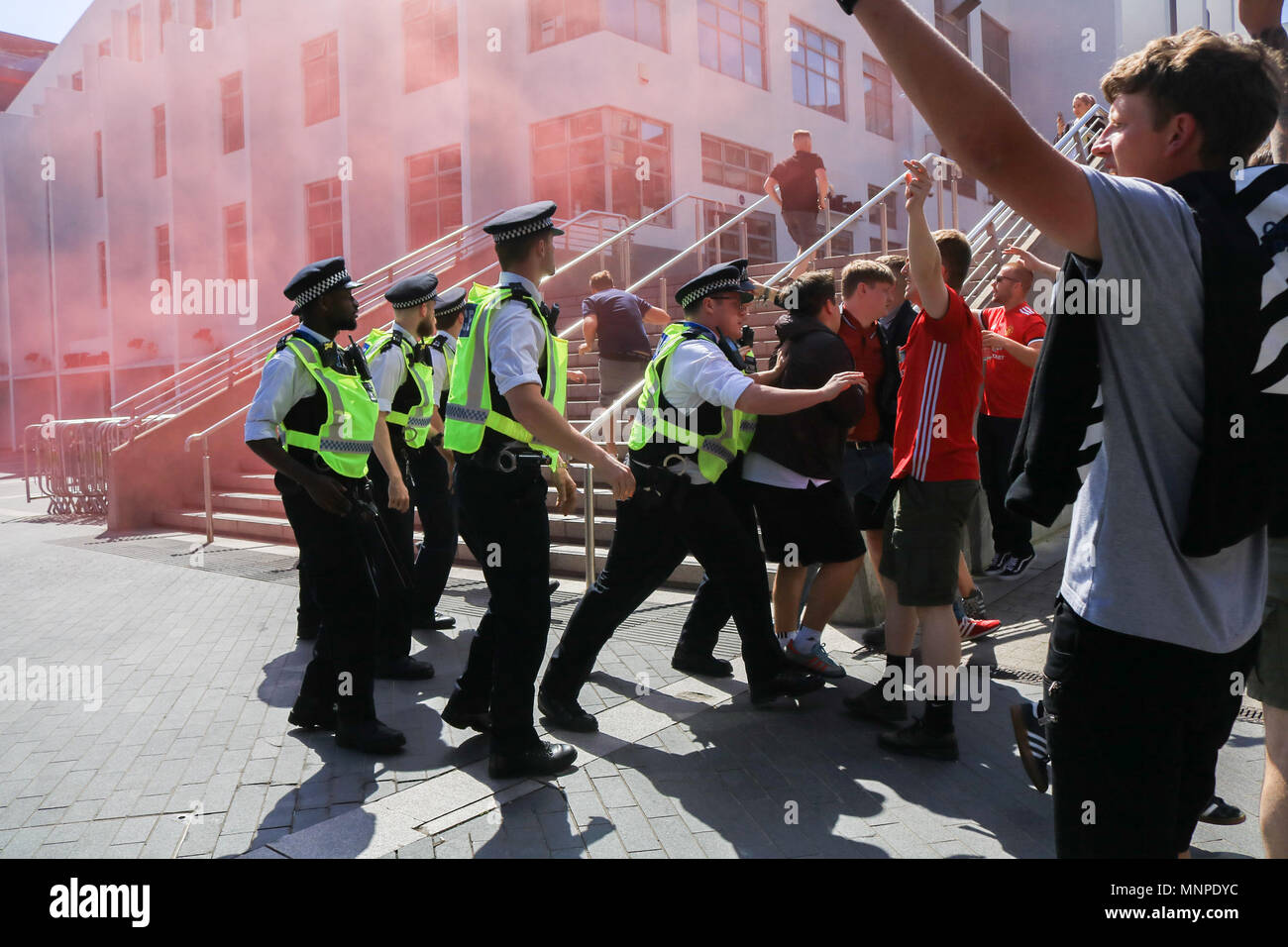 Wembley Middlesex, UK. 19th May 2018. Red smoke flares are thrown in ...