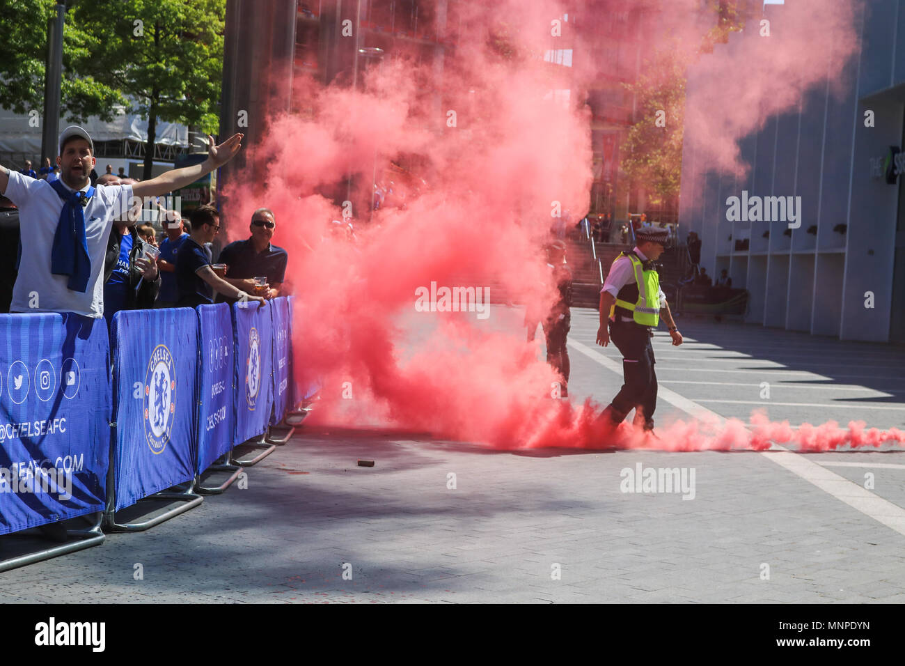 Wembley Middlesex, UK. 19th May 2018. Red smoke flares are thrown in ...