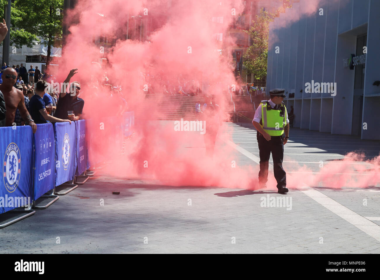 Wembley Middlesex, UK. 19th May 2018. Red smoke flares are thrown in ...